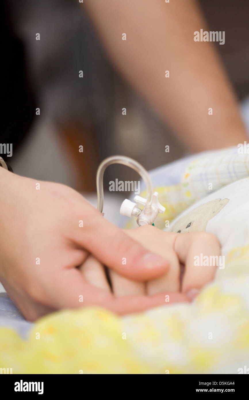 Human hand on iv drip hi-res stock photography and images - Alamy