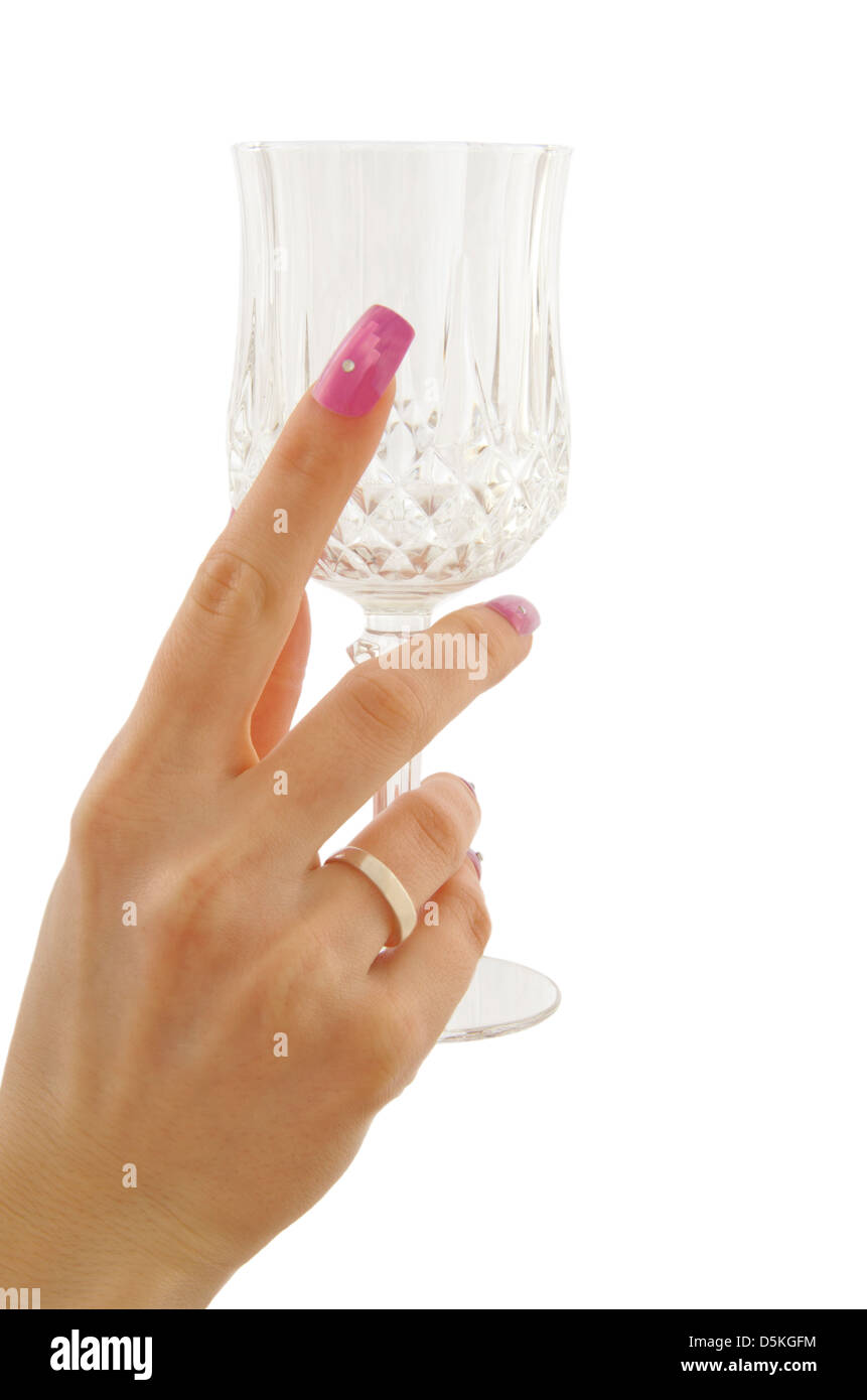 Female hand holding crystal glass over white Stock Photo - Alamy