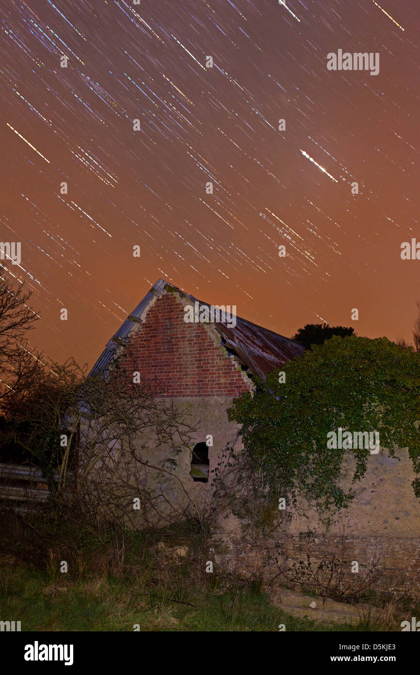 Star trails over an old derelict Devon cobb barn Stock Photo - Alamy