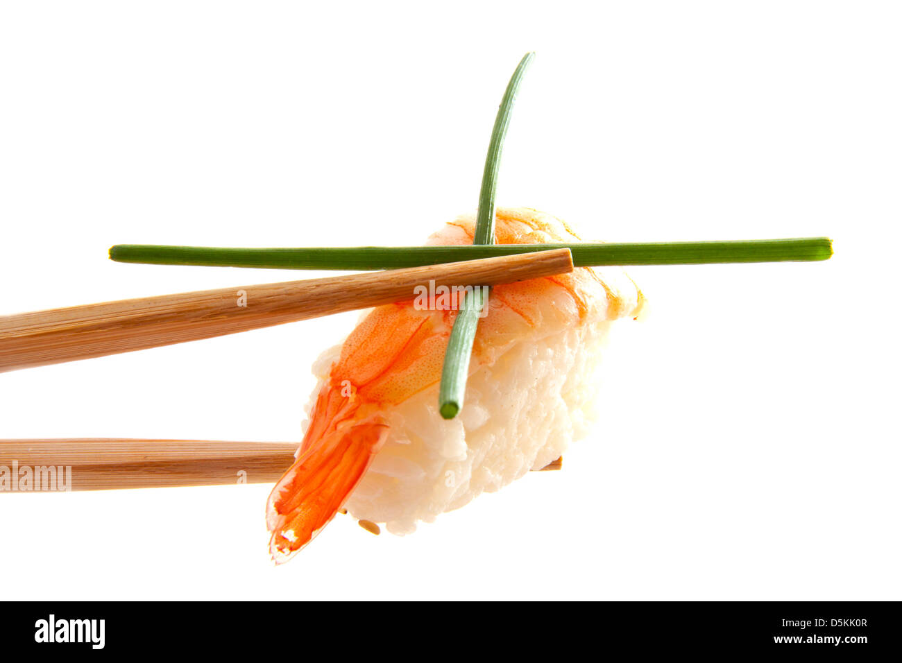 Japanese sushi between sticks isolated over white Stock Photo - Alamy