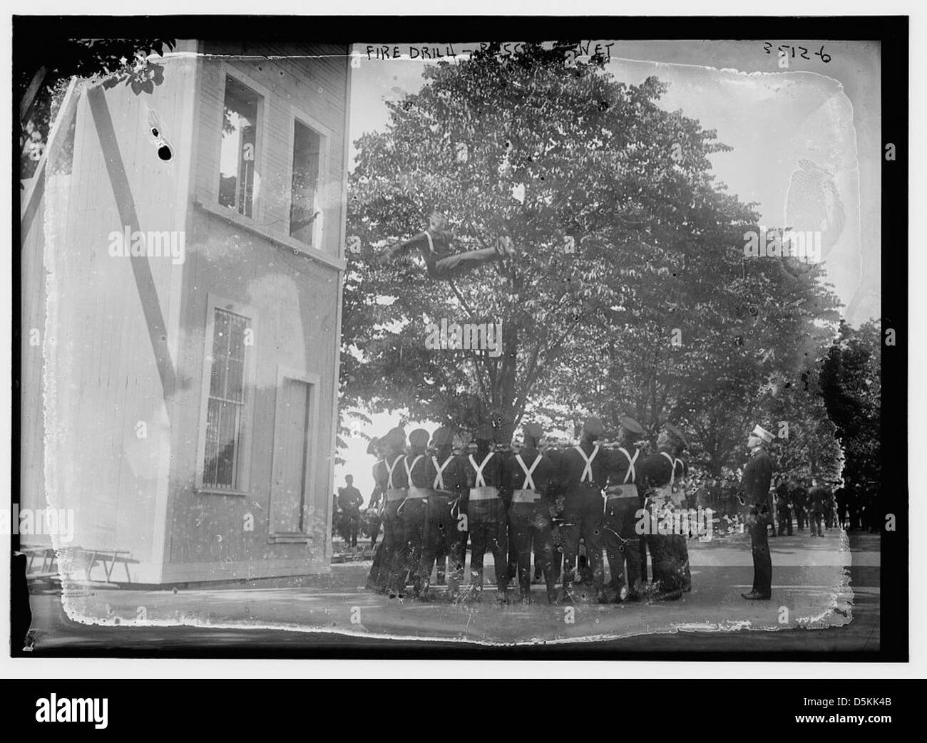 This photograph shows a fire drill in progress, with a rescue net being ...