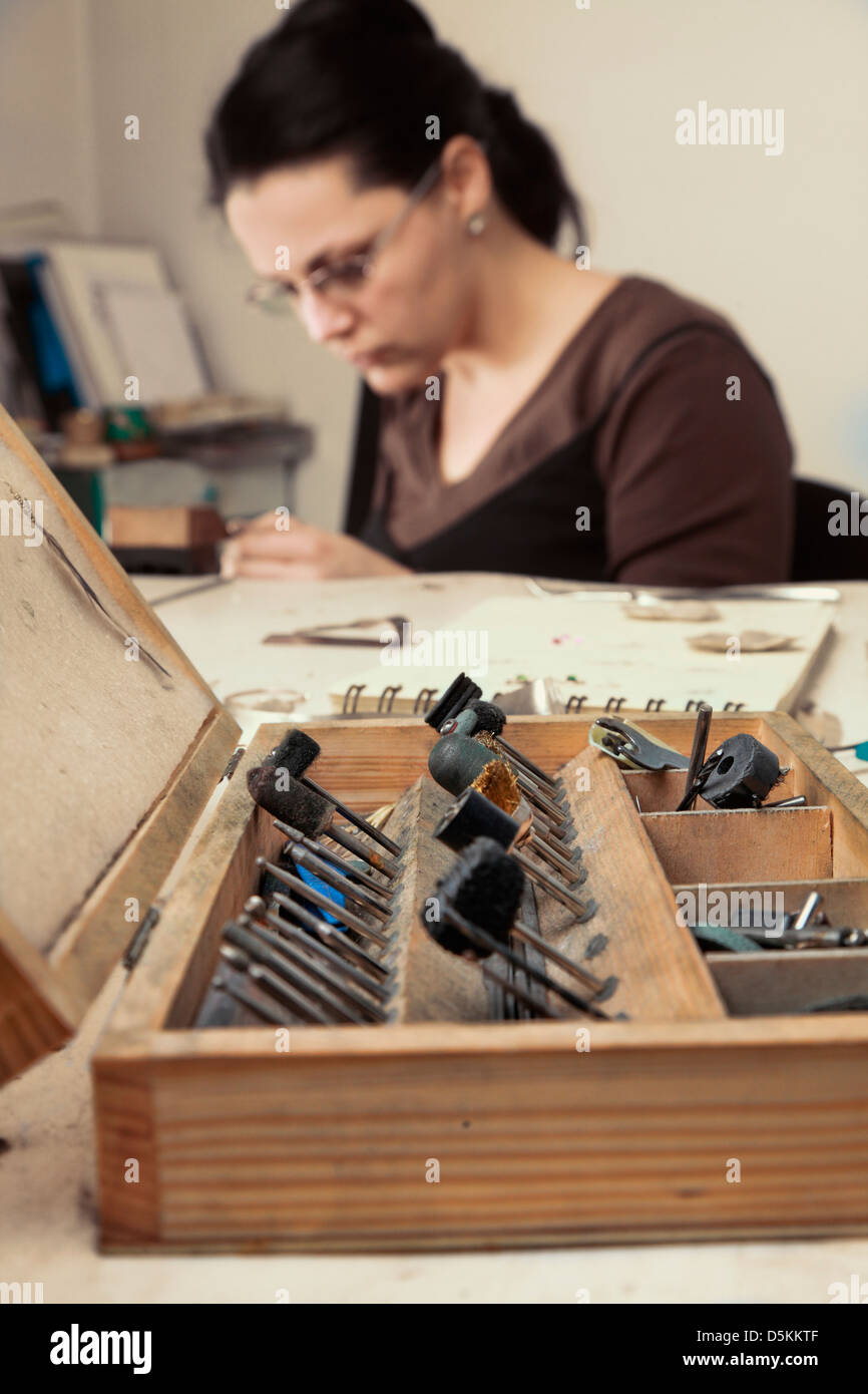 Female goldsmith at work with a drill hi-res stock photography and ...