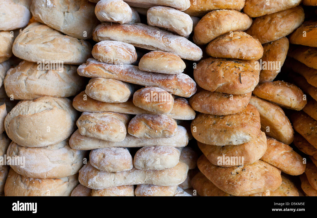 Food stacked up on a stall in Borough Market. Baked bread rolls Stock ...