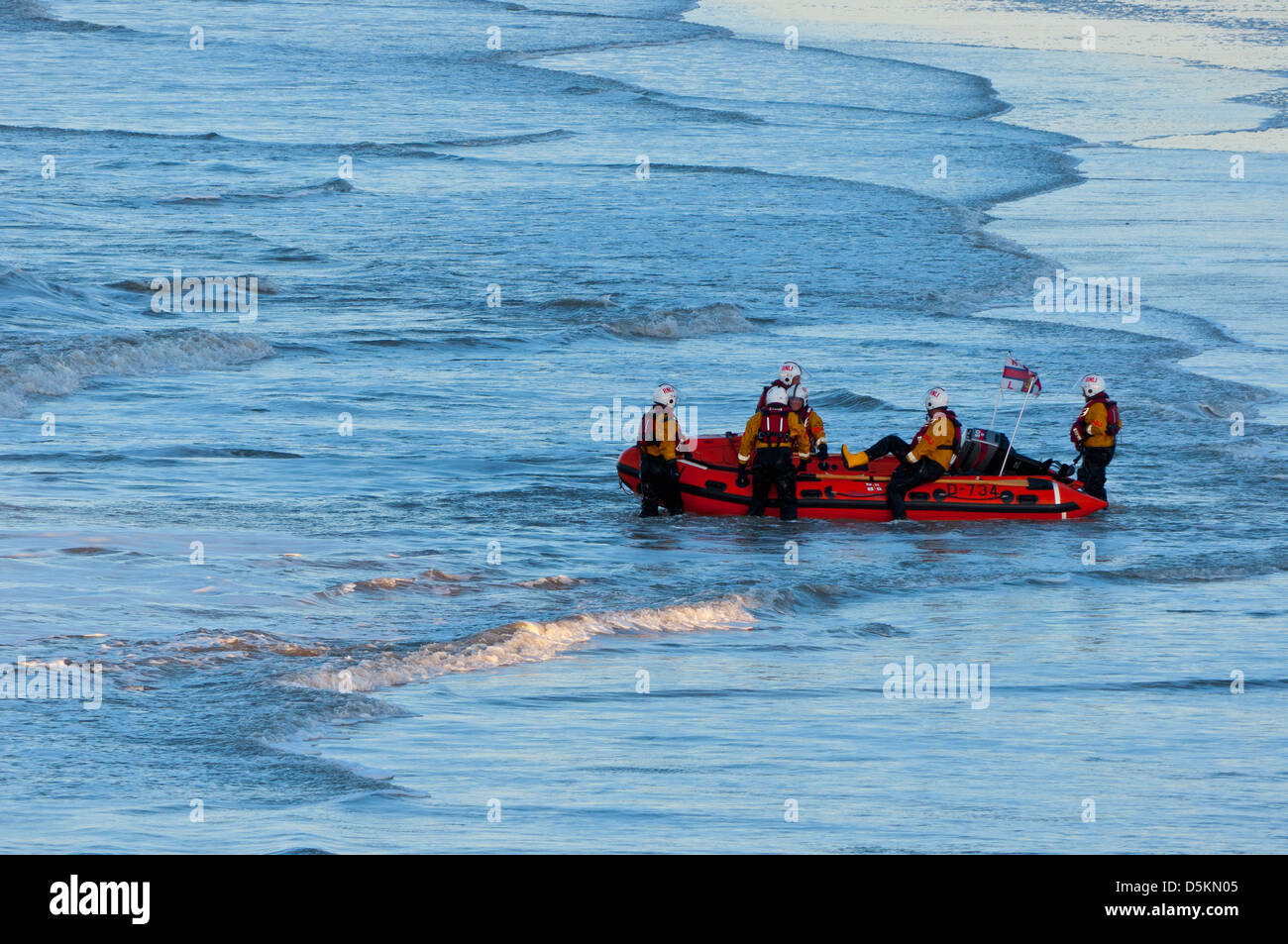 Launching Cromer RNLI inshore lifeboat from beach Stock Photo - Alamy
