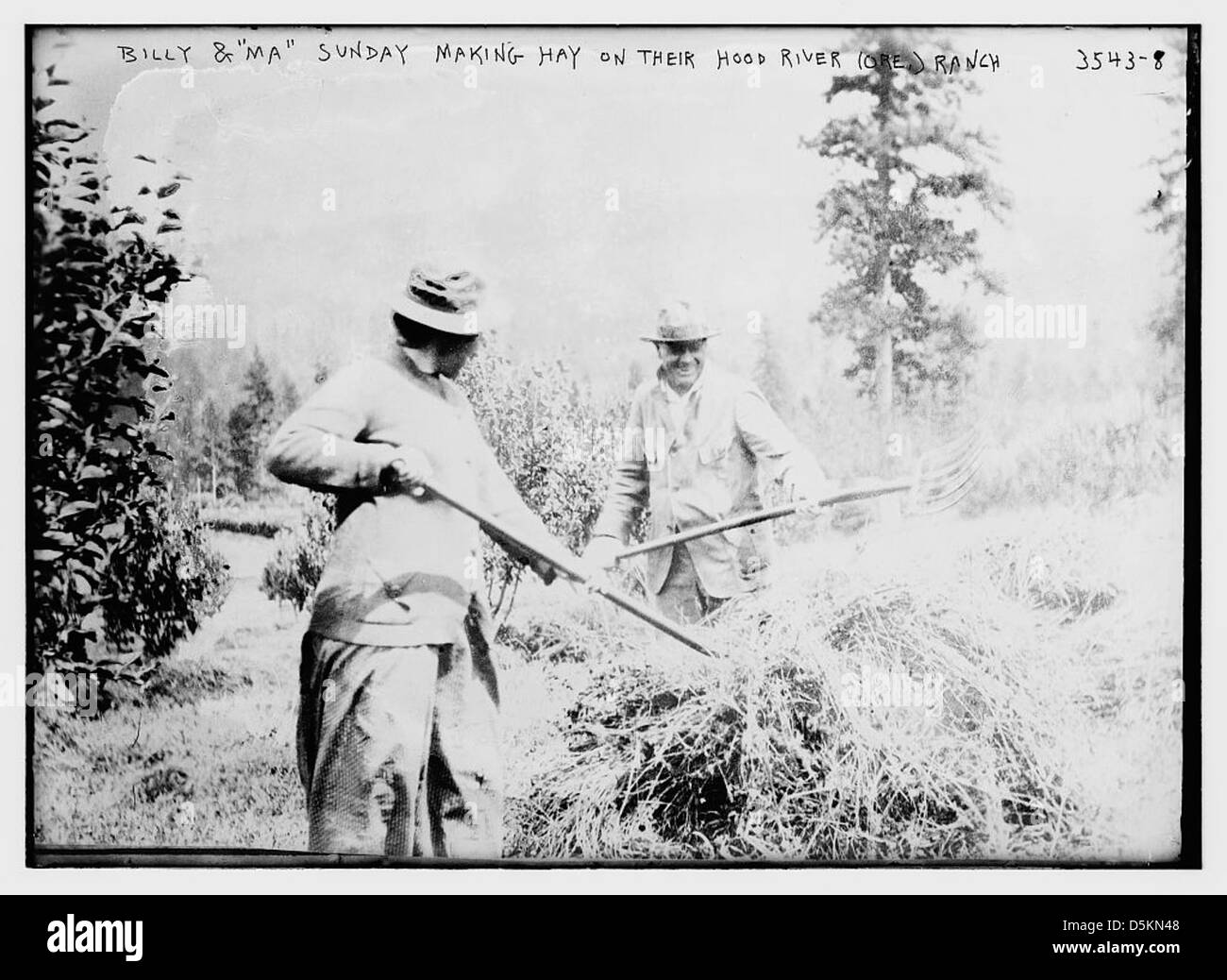 A photograph of Billy Sunday and his wife, Helen, working on their ...
