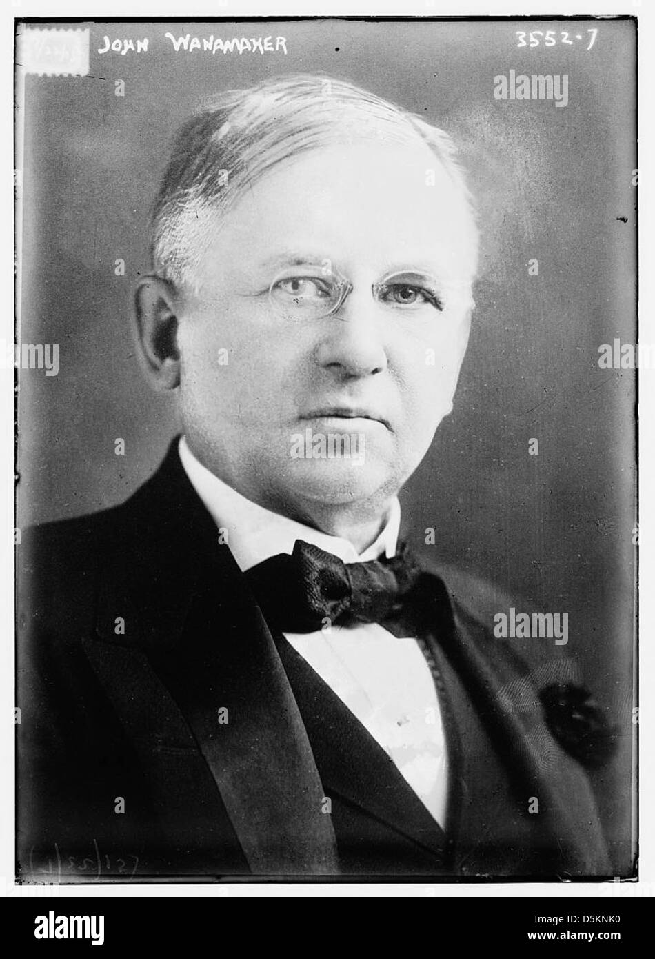 A portrait of John Wanamaker, an older man wearing eyeglasses and a ...