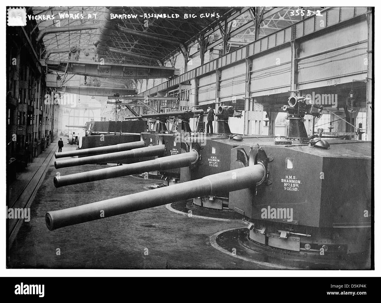 Vickers Works at Barrow is shown assembling large naval guns for the ...