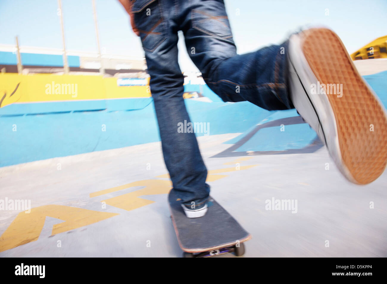 Legs on moving skateboard Stock Photo - Alamy