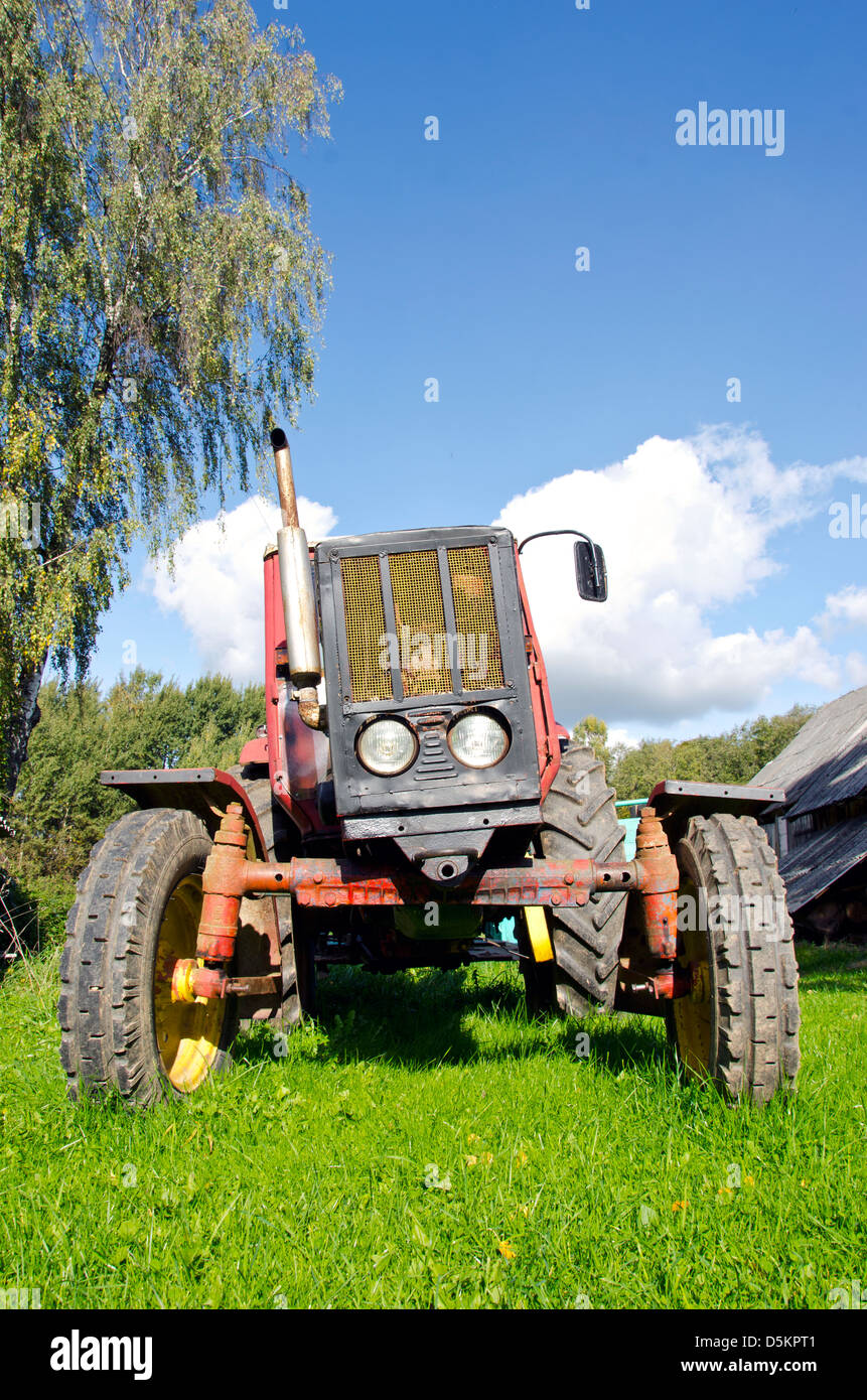 ancient agriculture tractor in farm garden Stock Photo - Alamy