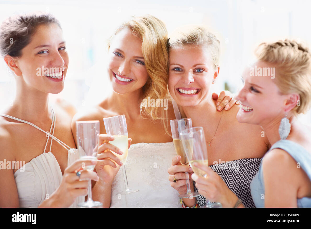 Bride and bridesmaids toasting Stock Photo - Alamy