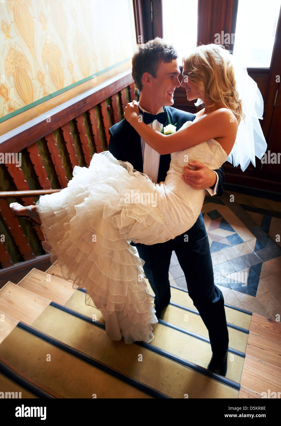 Carrying bride hi-res stock photography and images - Alamy