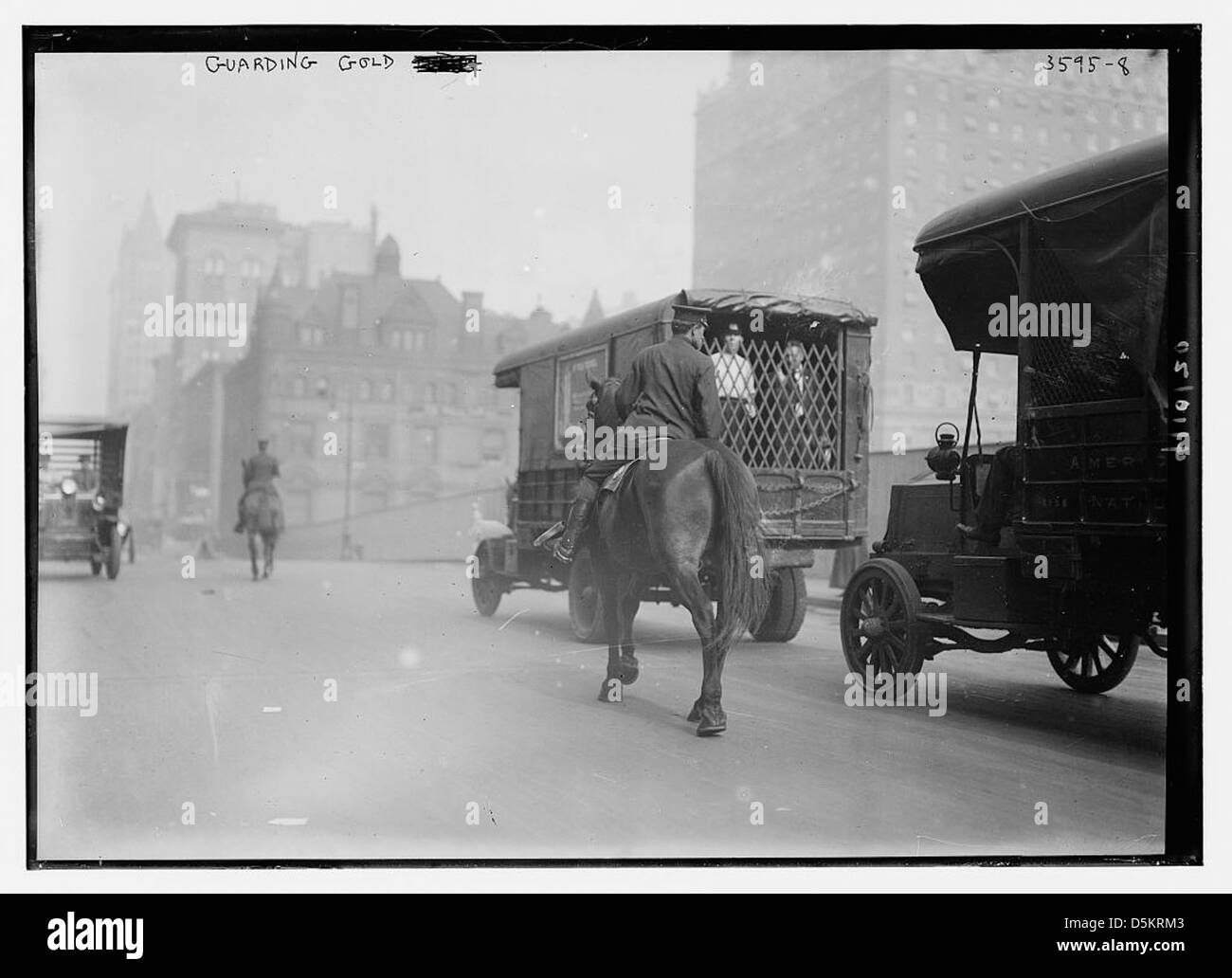 A photograph showing a group of people guarding gold during the Gold ...