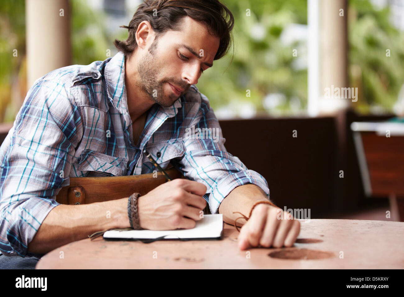 Man doing notes Stock Photo - Alamy