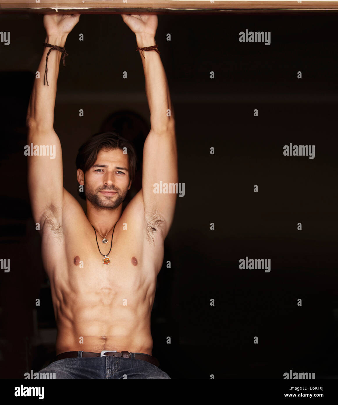Portrait of man, arms raised Stock Photo - Alamy