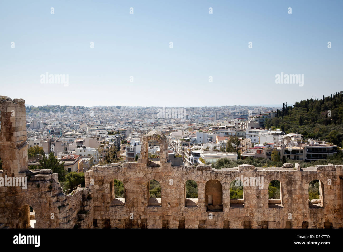 View across Athens from the Acropolis. The walls of the Odeion of ...