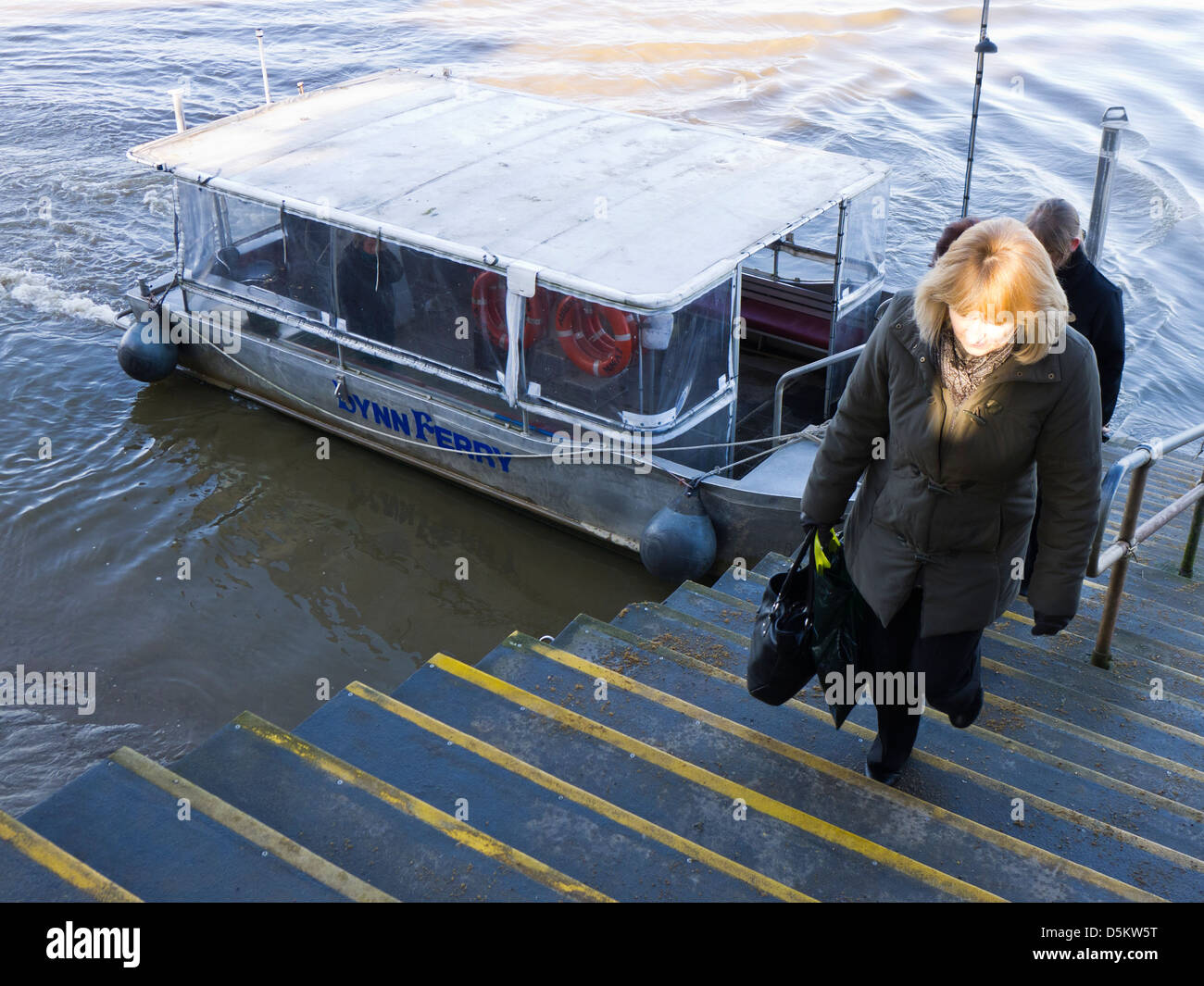 Commuters disembark from the ferry from West Lynn to King's Lynn Stock ...