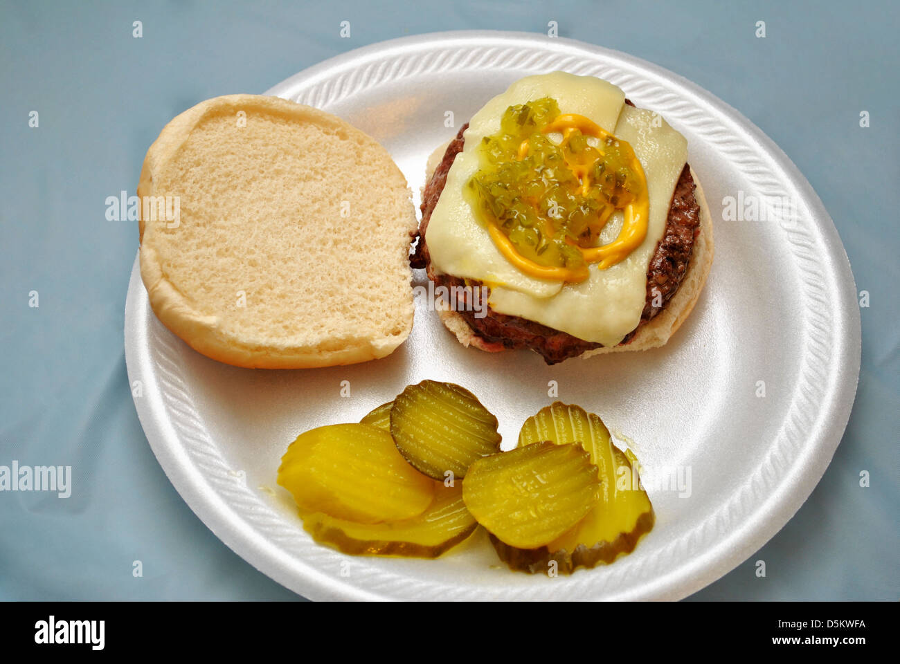 Cheeseburger with Relish and Mustard Stock Photo - Alamy