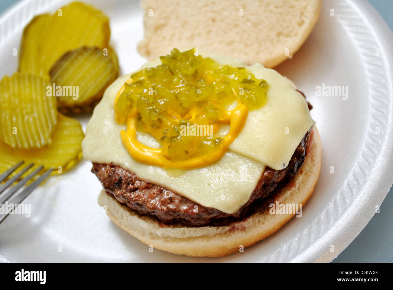 Close-Up of a Cheeseburg with Relish and Mustard Stock Photo - Alamy