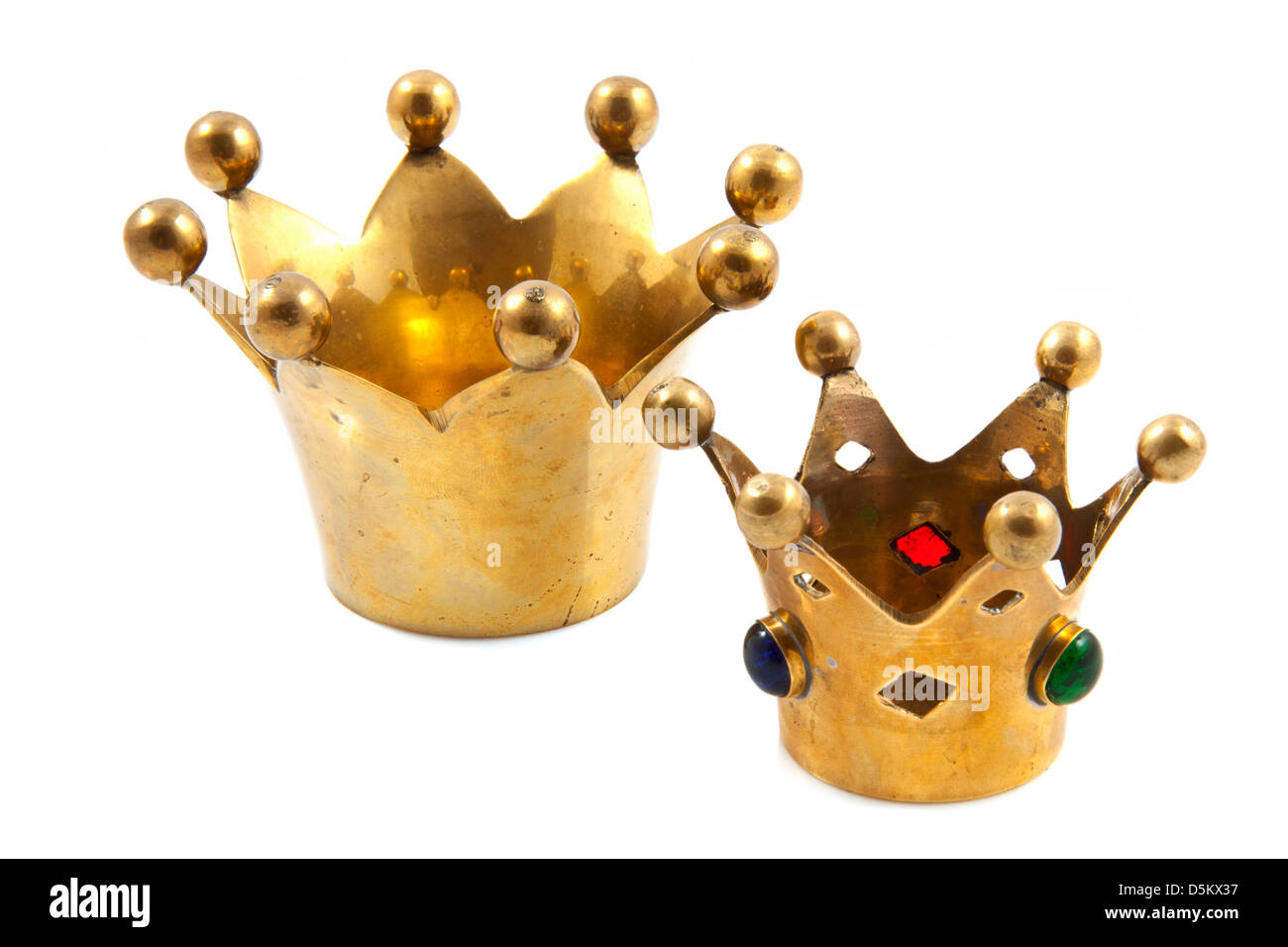 Two golden crowns isolated on a white background Stock Photo - Alamy