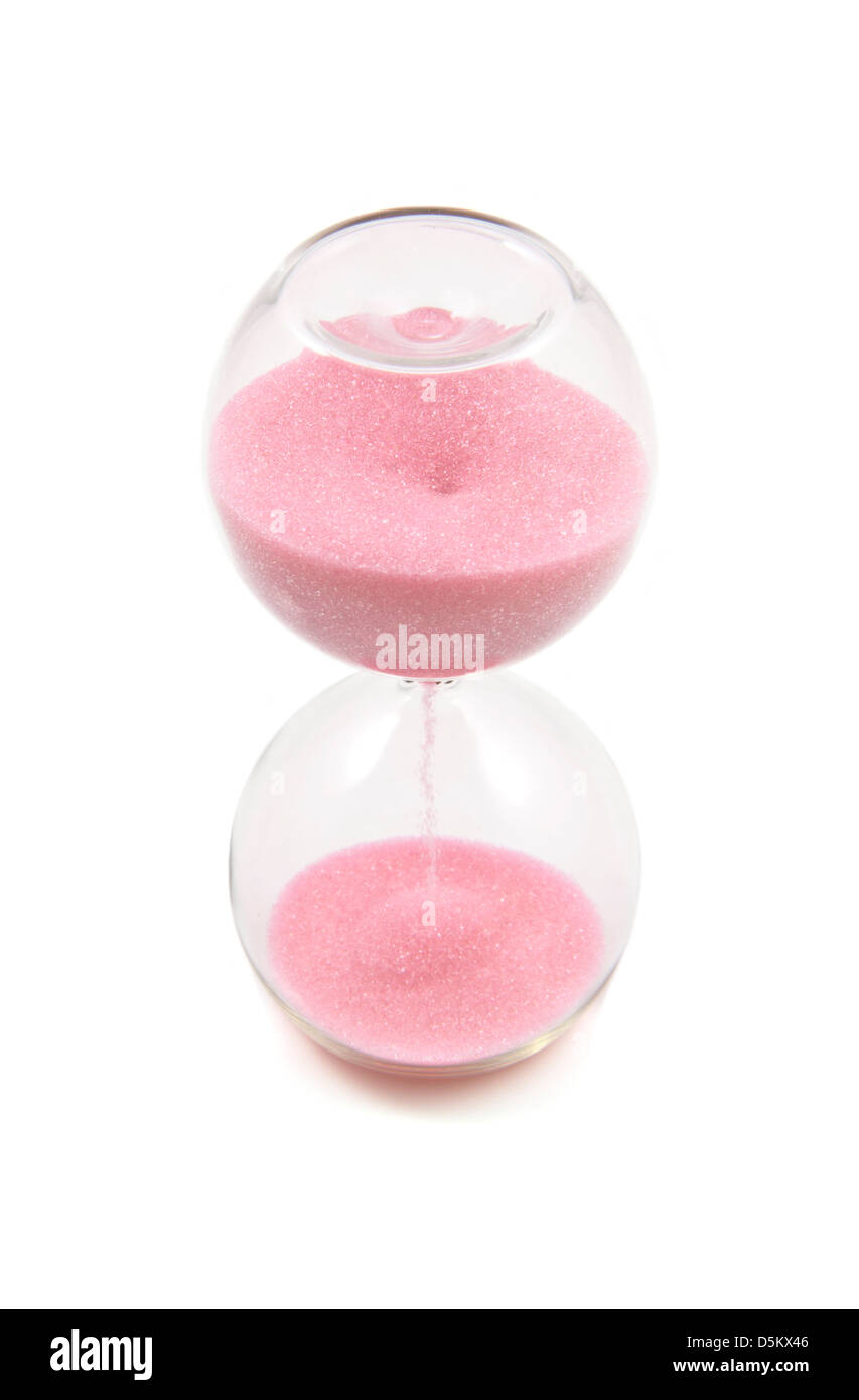Modern hourglass with pink sand isolated over white Stock Photo - Alamy