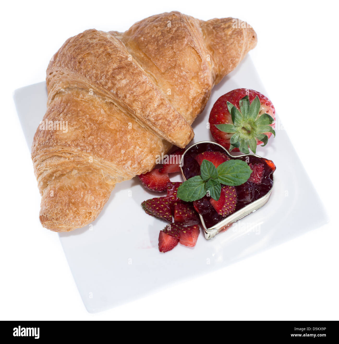 Croissant on a plate with strawberry jam Stock Photo - Alamy