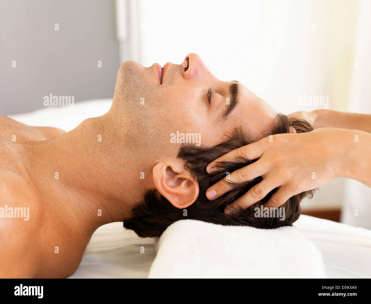 Man receiving massage in spa Stock Photo - Alamy