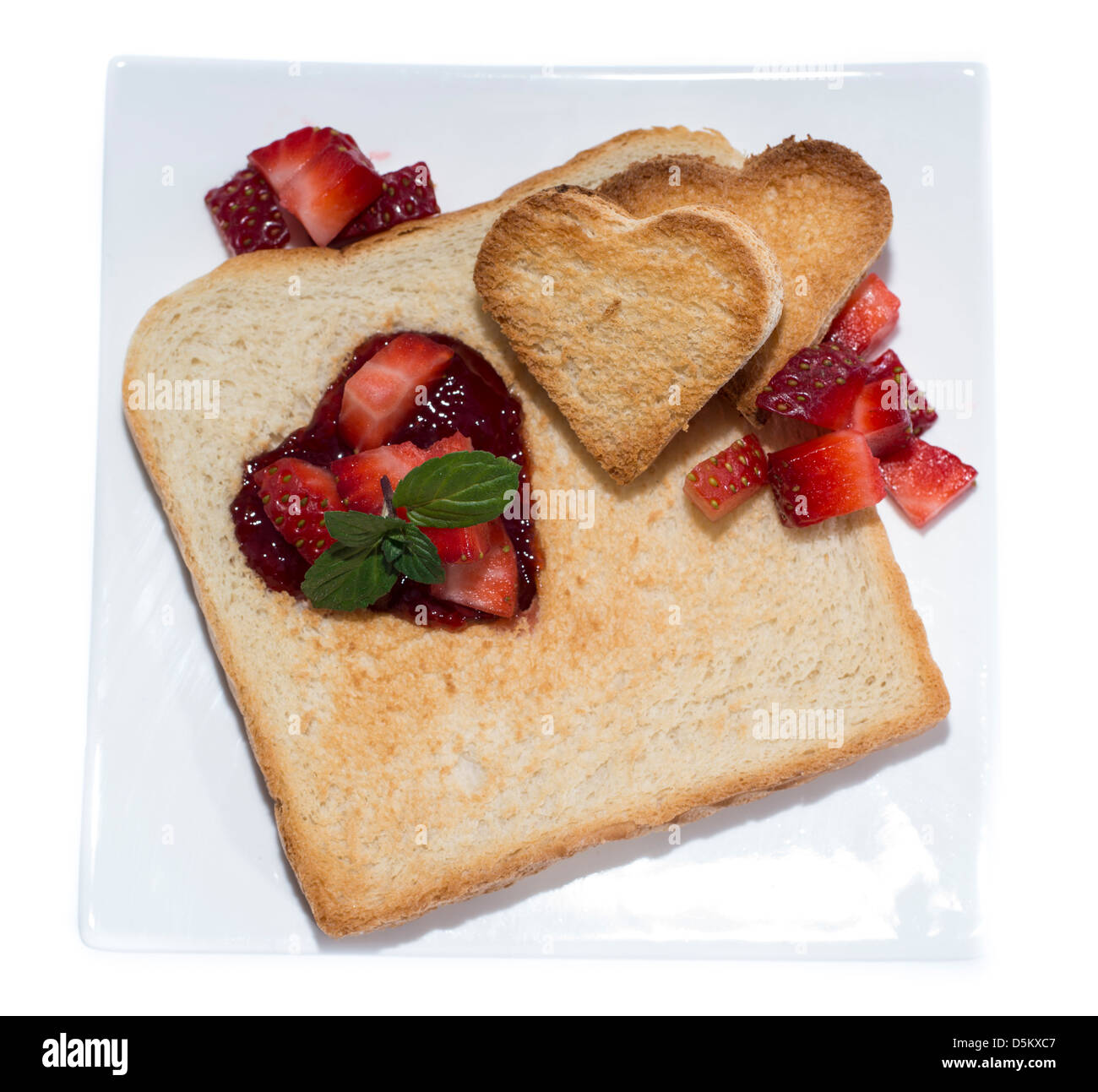 Toast with Hearts on a plate isolated on white background Stock Photo ...