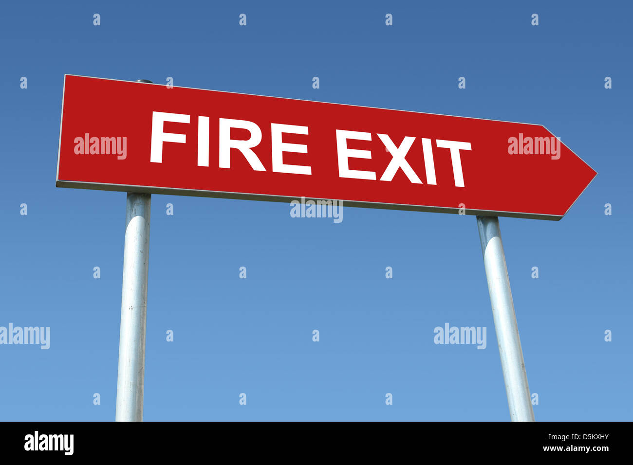 Red metal signpost spelling Fire Exit over blue sky Stock Photo - Alamy