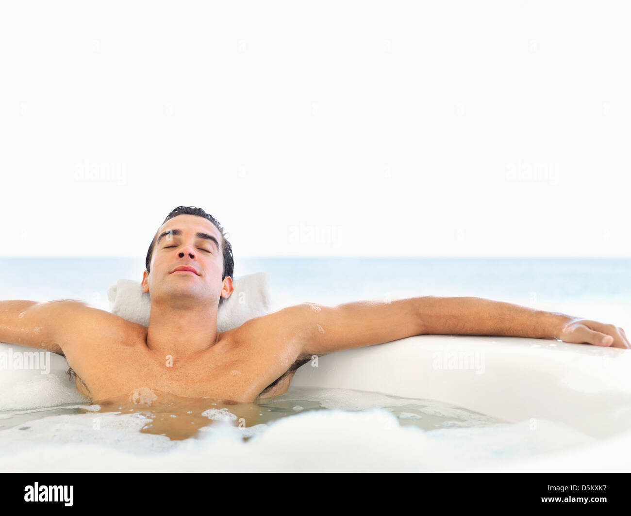 Man relaxing in bathtub Stock Photo - Alamy