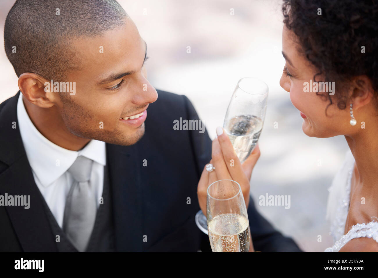 Newly wed couple drinking champagne Stock Photo - Alamy