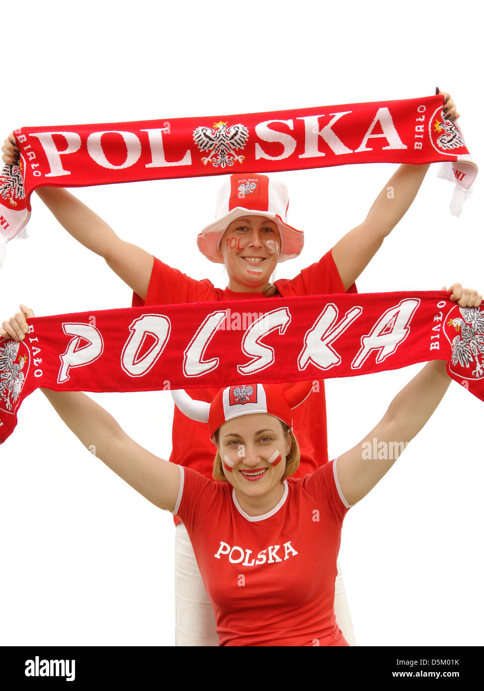 Three young Polish soccer fans dressed in Polish national color t ...