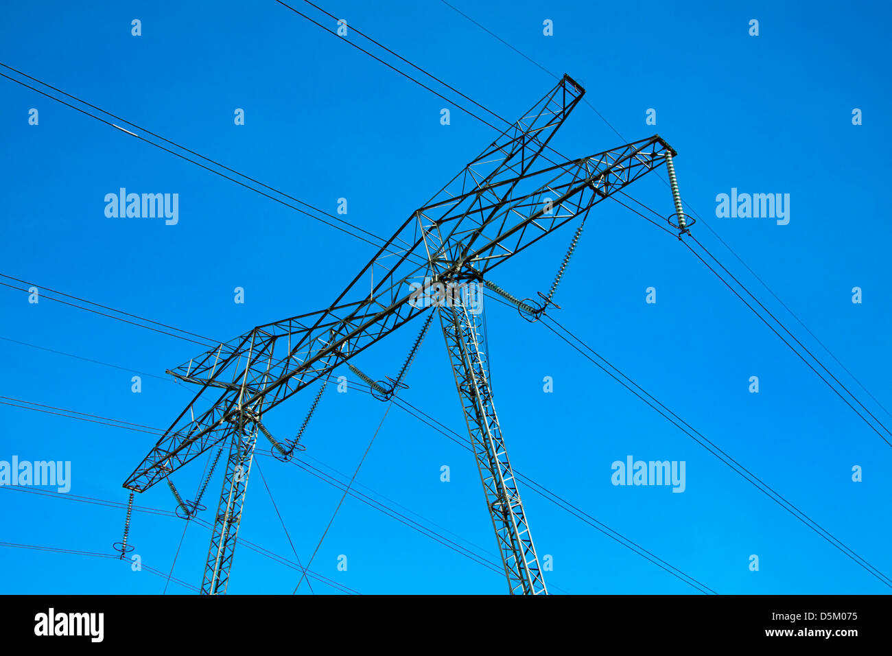 Steel lattice high voltage transmission tower with deep-blue sky Stock ...