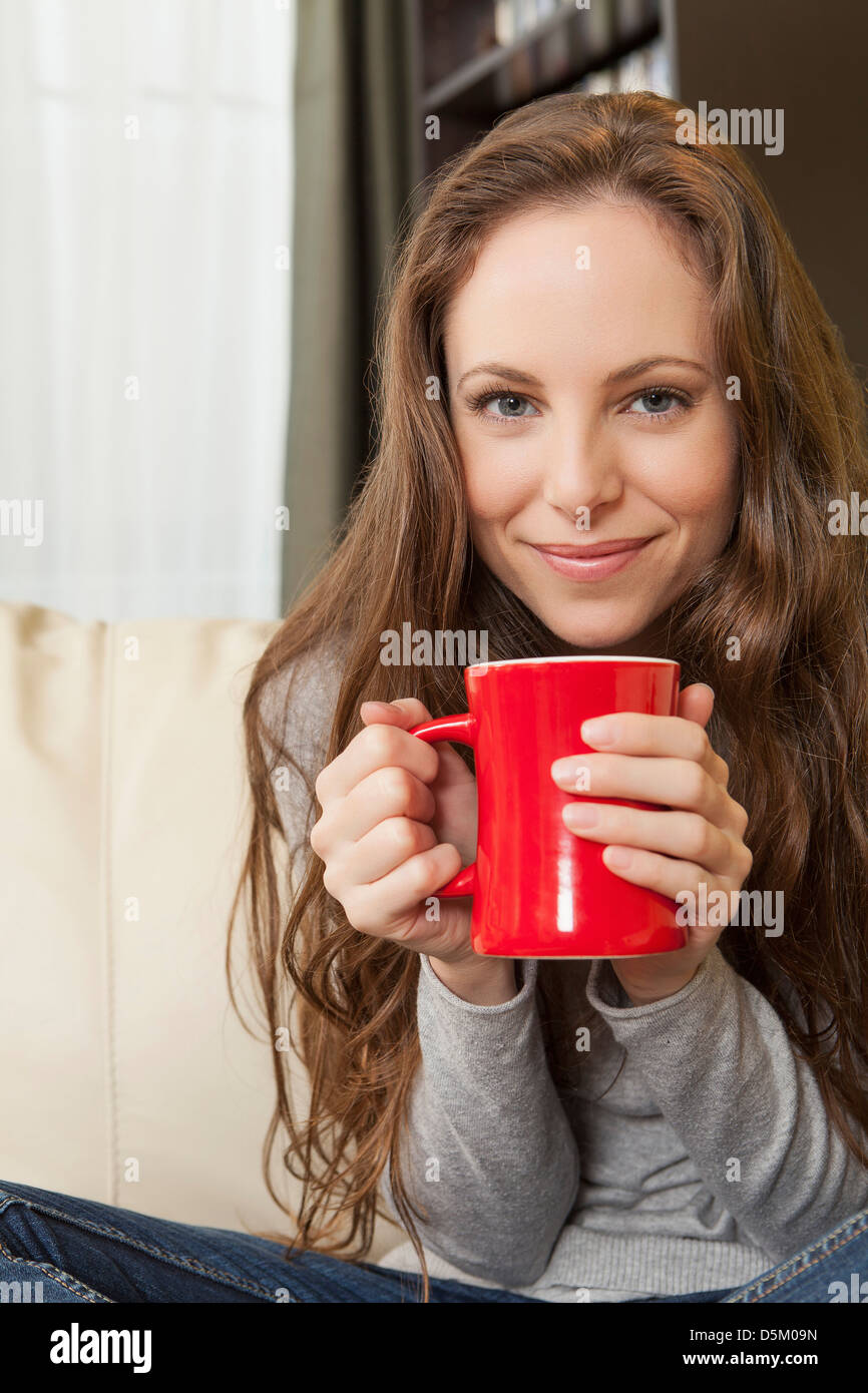 Woman drink smiling mid adult hi-res stock photography and images - Alamy