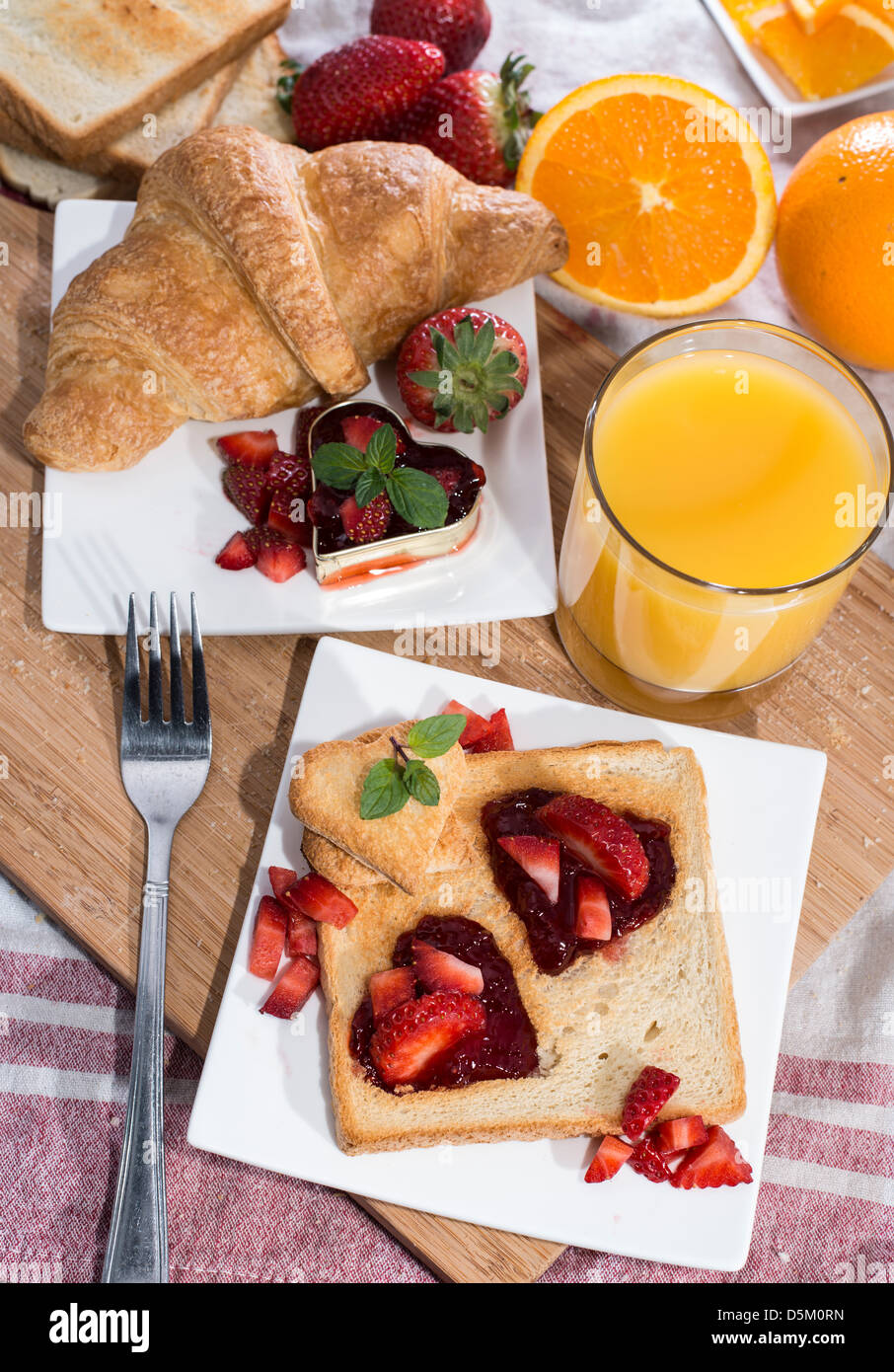 Breakfast Table with toast, strawberry jam and orange juice Stock Photo ...