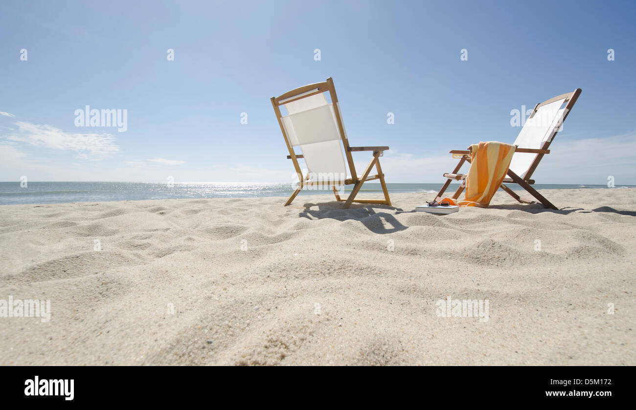 Sun chairs on sandy beach Stock Photo - Alamy