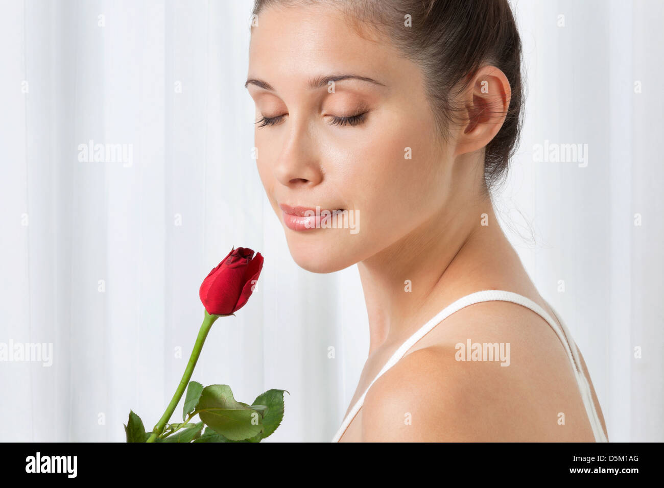 Woman With Red Rose Stock Photo - Alamy