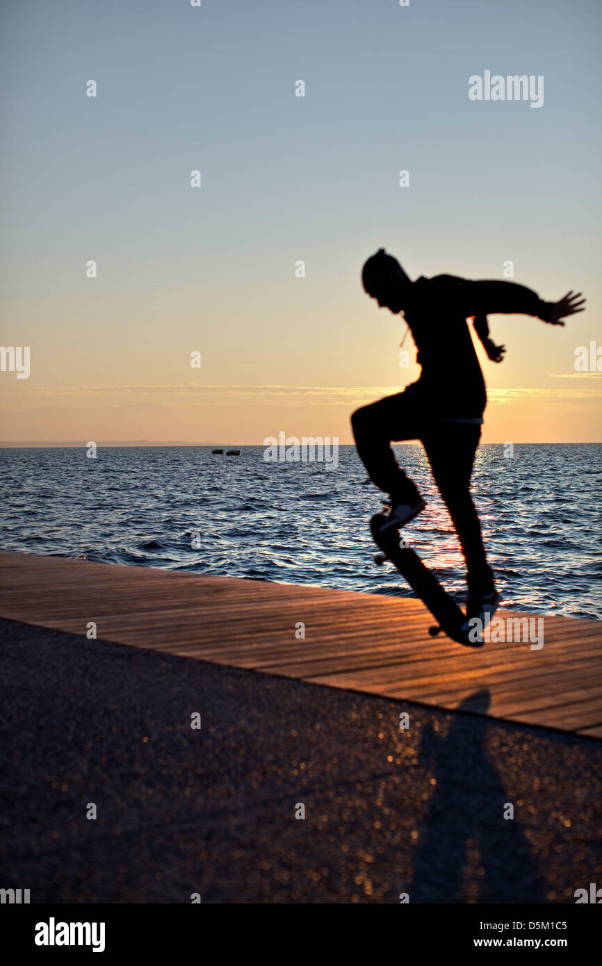 Skateboarding in the sunset Stock Photo - Alamy