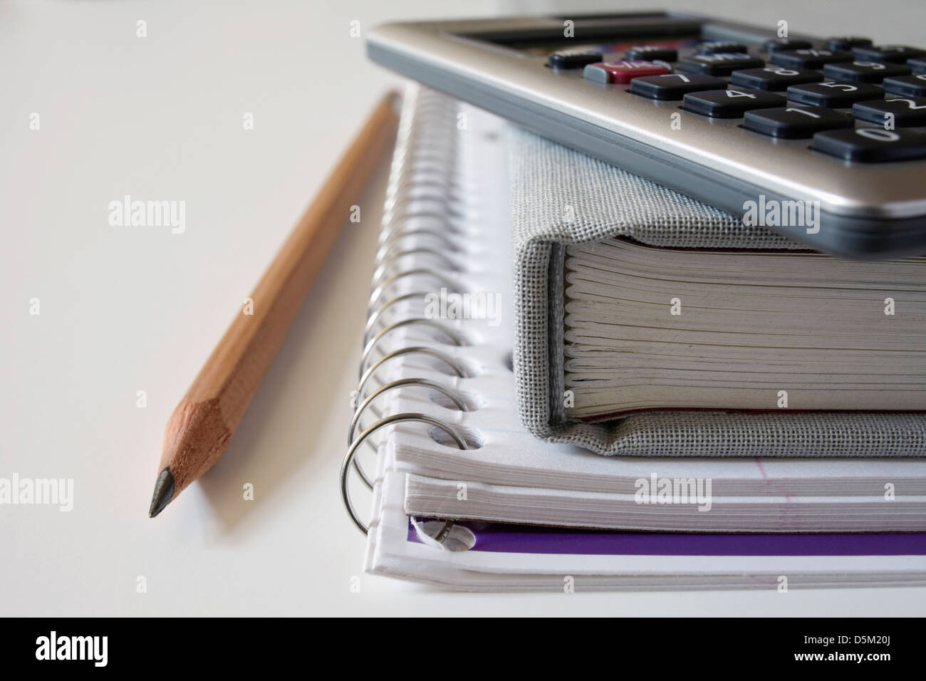 Pencil on calculator hi-res stock photography and images - Alamy
