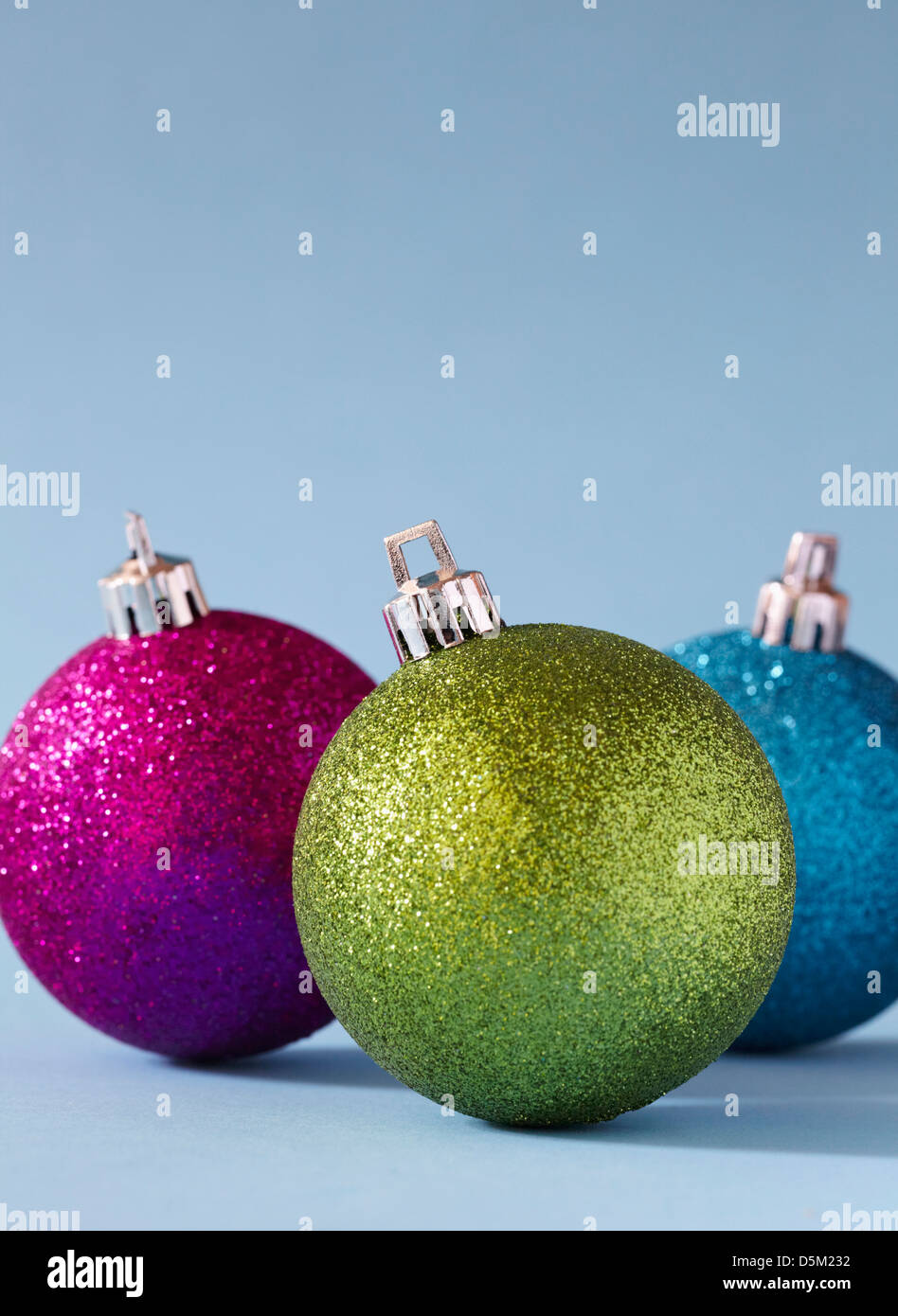Three Christmas baubles Stock Photo - Alamy