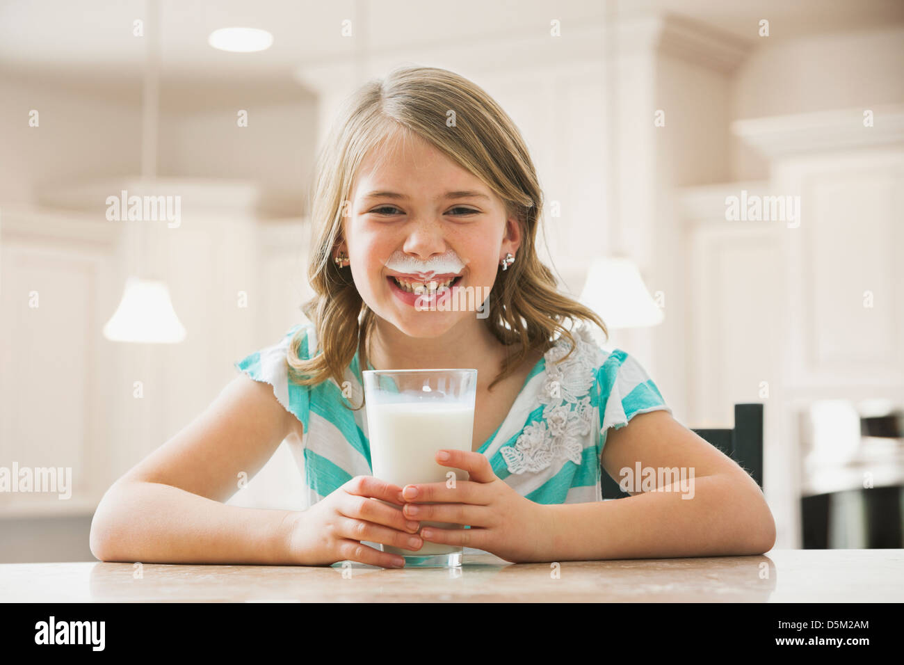 Smiling girl glass milk hi-res stock photography and images - Alamy