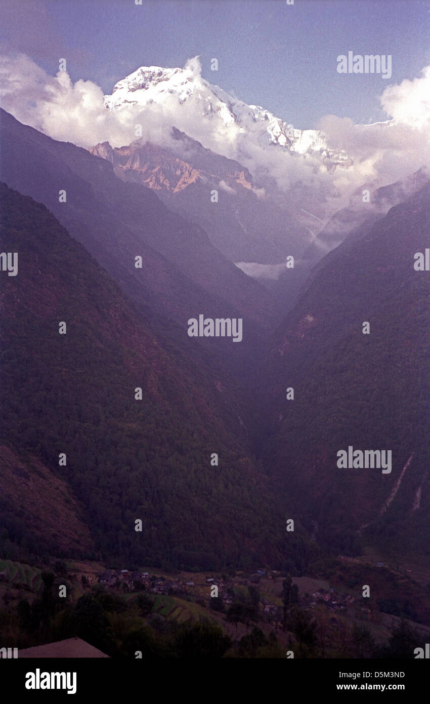 Misty evening view of Modi Khola Valley from Chomrong on Annapurna ...