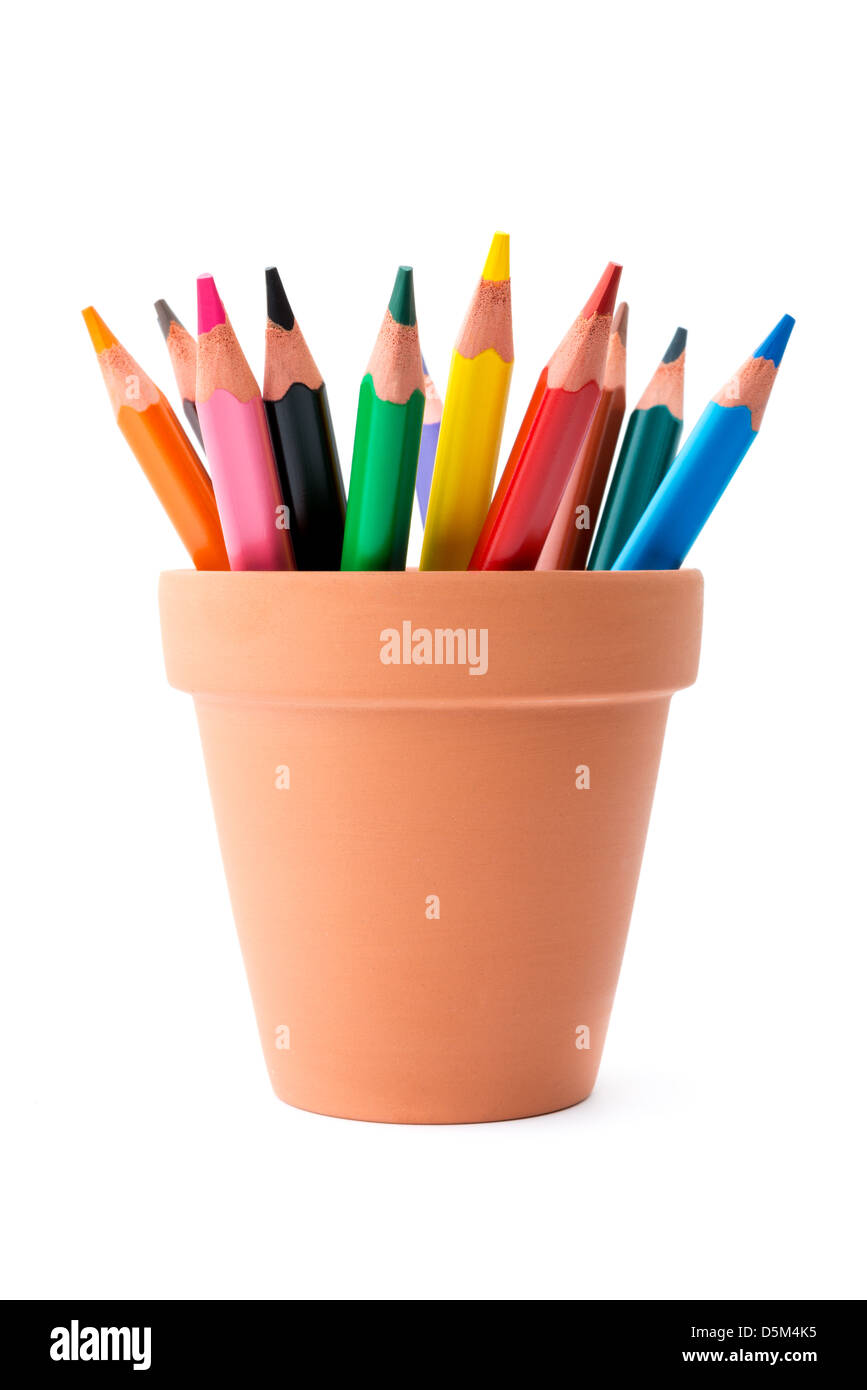 Drawing supplies: assorted color pencils in ceramic pot, isolated on ...