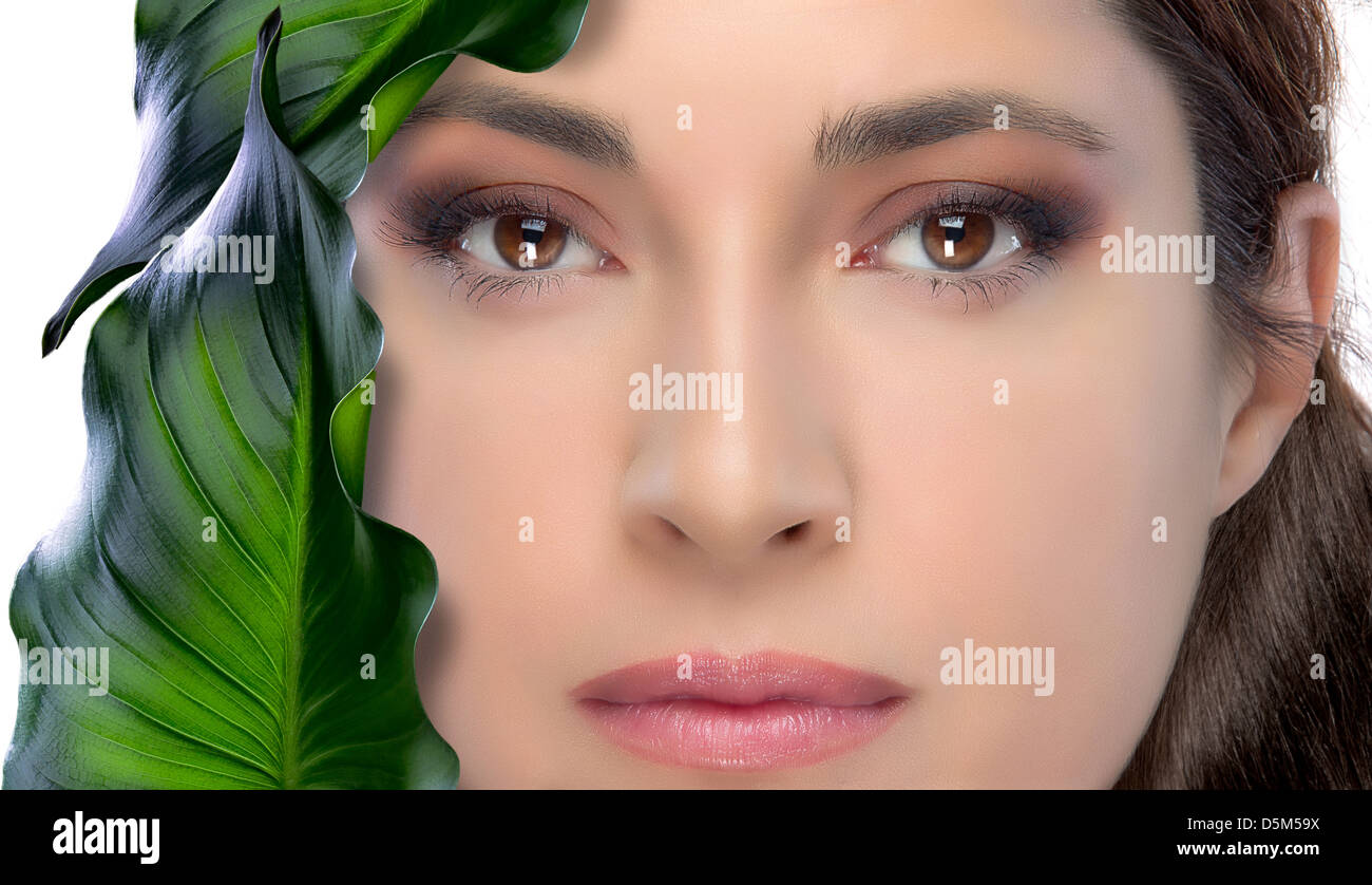 Spa beauty woman with green leaves on the face Stock Photo - Alamy