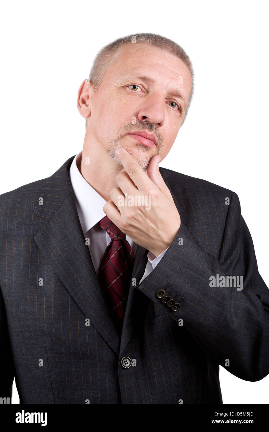 Mature businessman scratching his chin Stock Photo - Alamy