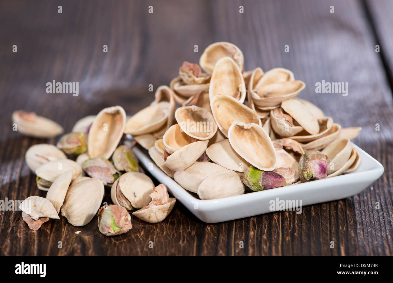 Pistachio Shells on vintage wooden background Stock Photo - Alamy
