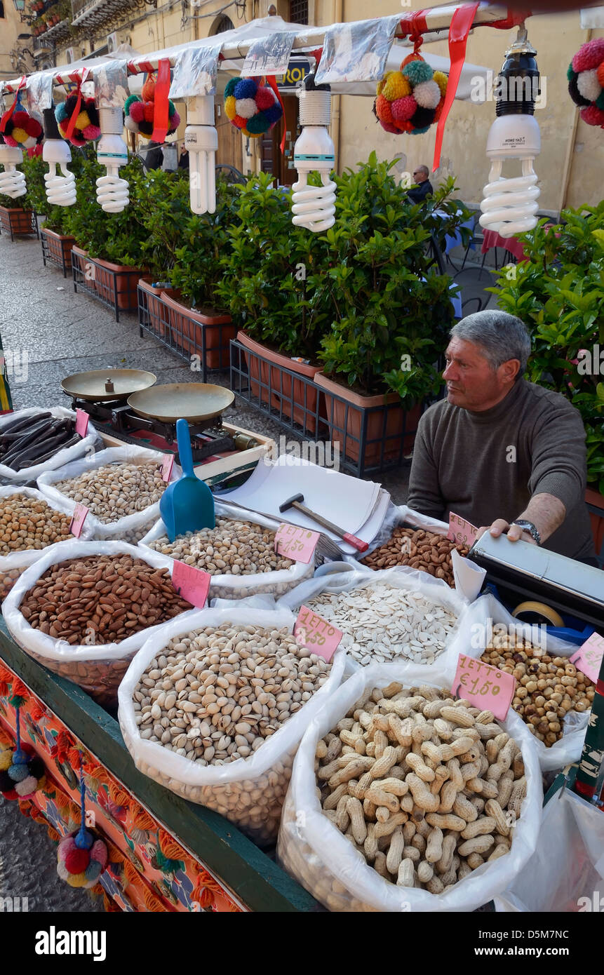 Vendor selling nuts on street in Monreale, Sicily, Italy Stock Photo ...