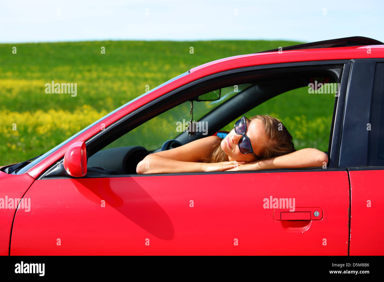 woman in red car get out window Stock Photo - Alamy