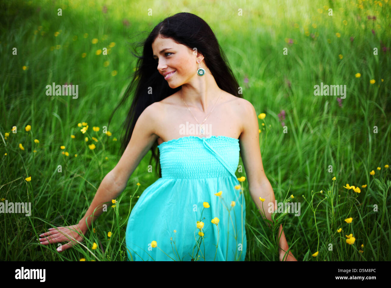 beautiful woman on flower field Stock Photo - Alamy