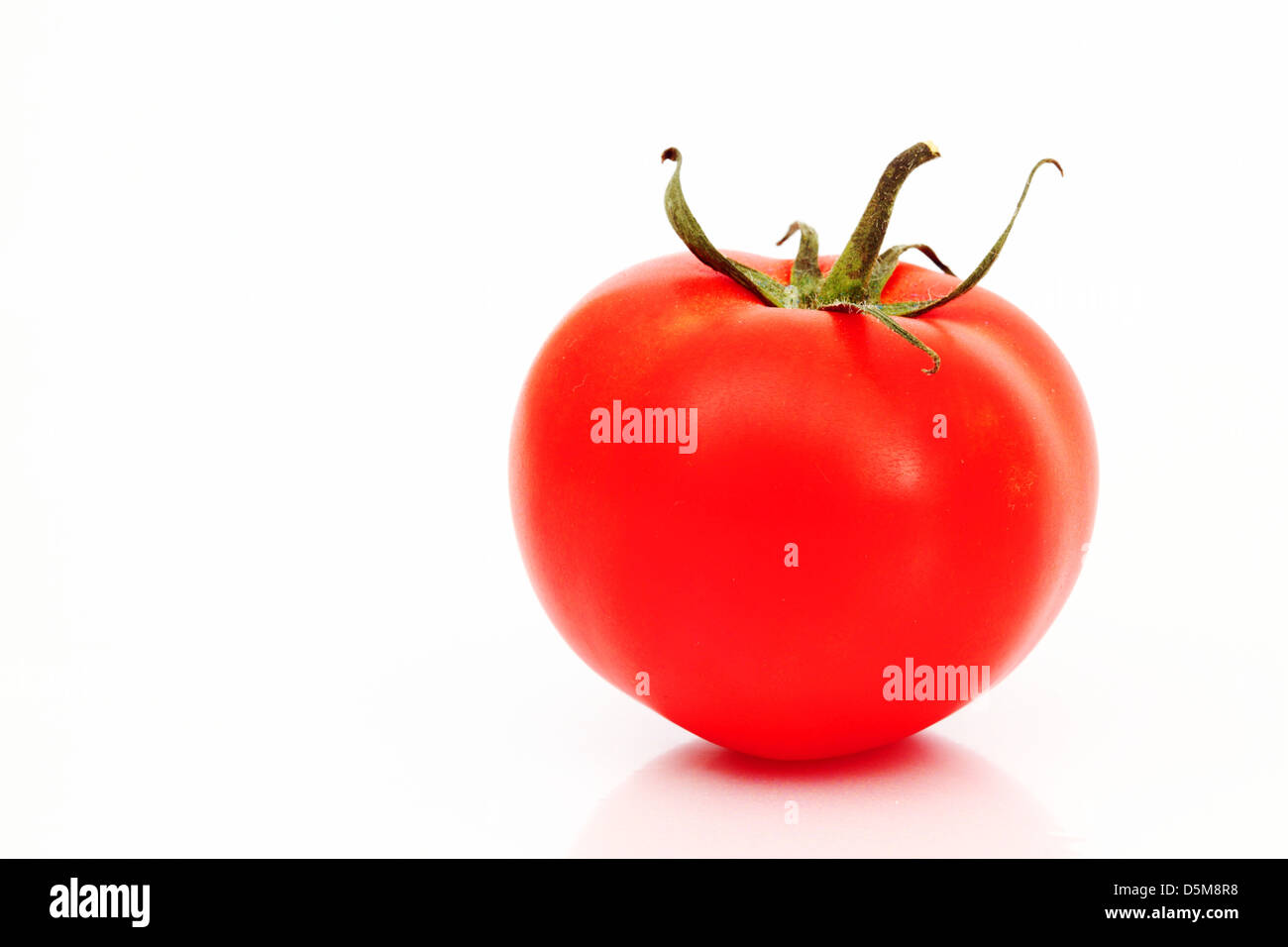 one tomato isolated on white Stock Photo - Alamy