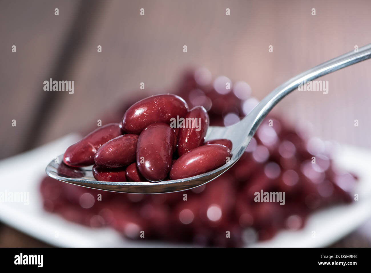 Kidney Beans on a Spoon with blurred portion in the background Stock ...